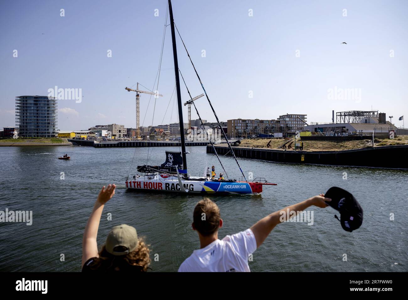 SCHEVENINGEN - Sailing vessels of the IMOCA class leave the harbor for ...