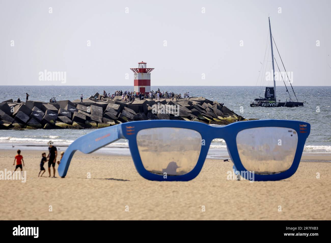 SCHEVENINGEN - Sailing vessels of the IMOCA class leave the harbor for ...