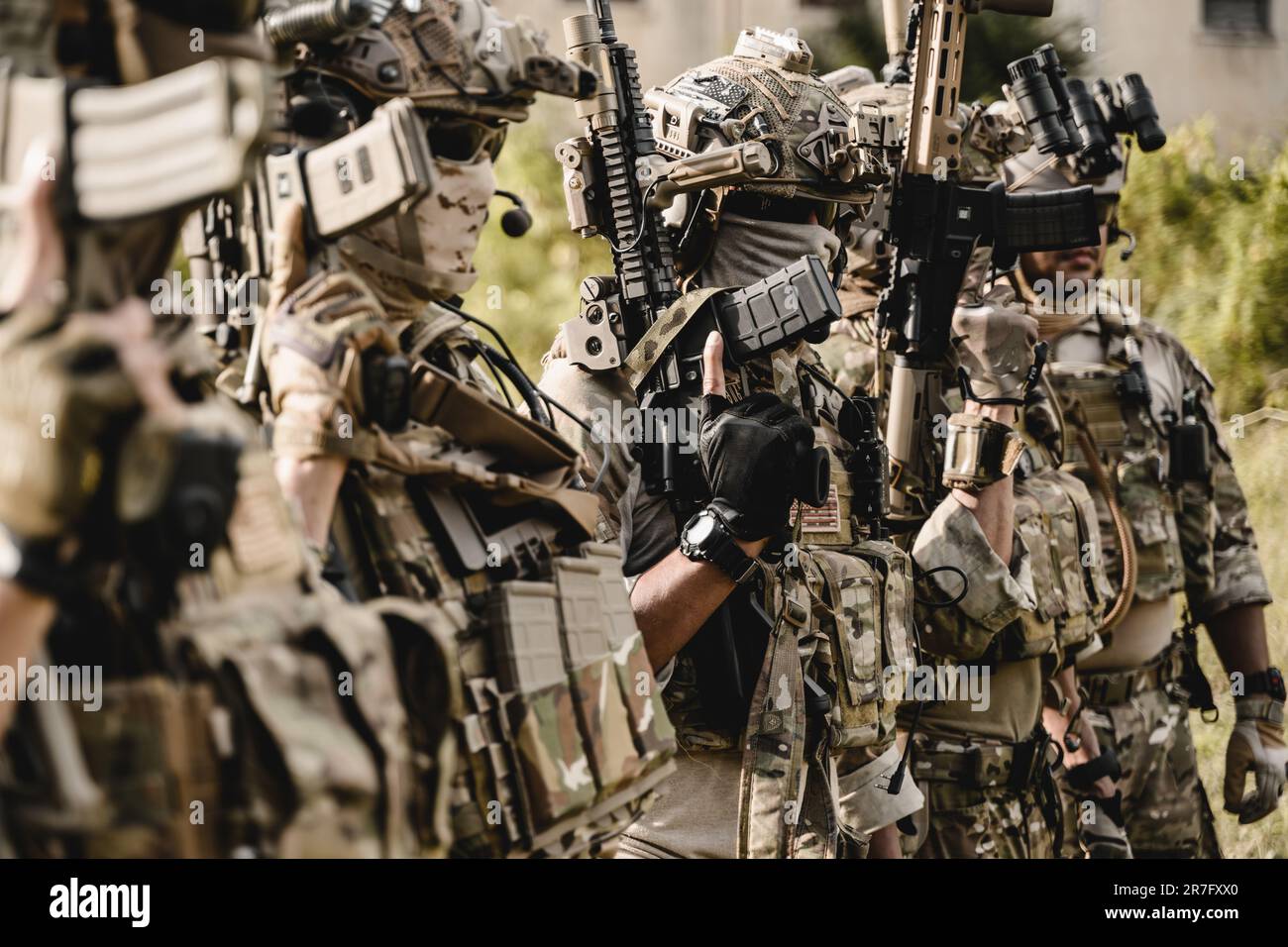 Smart teamwork of soldiers running forward and attacking enemy Stock ...