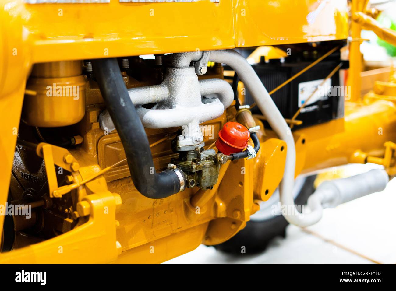 Small yellow tractor in exhibition, closeup details, wheels Stock Photo ...