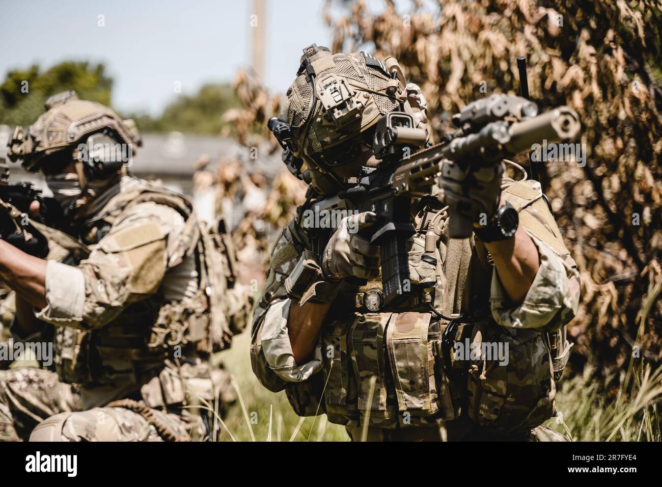 Soldiers running forward and attacking enemy during military operation ...