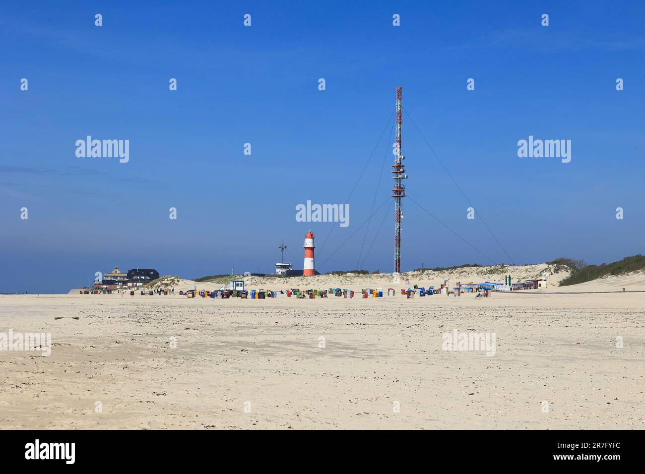 Electric lighthouse and new radio mast on Borkum beach Stock Photo - Alamy