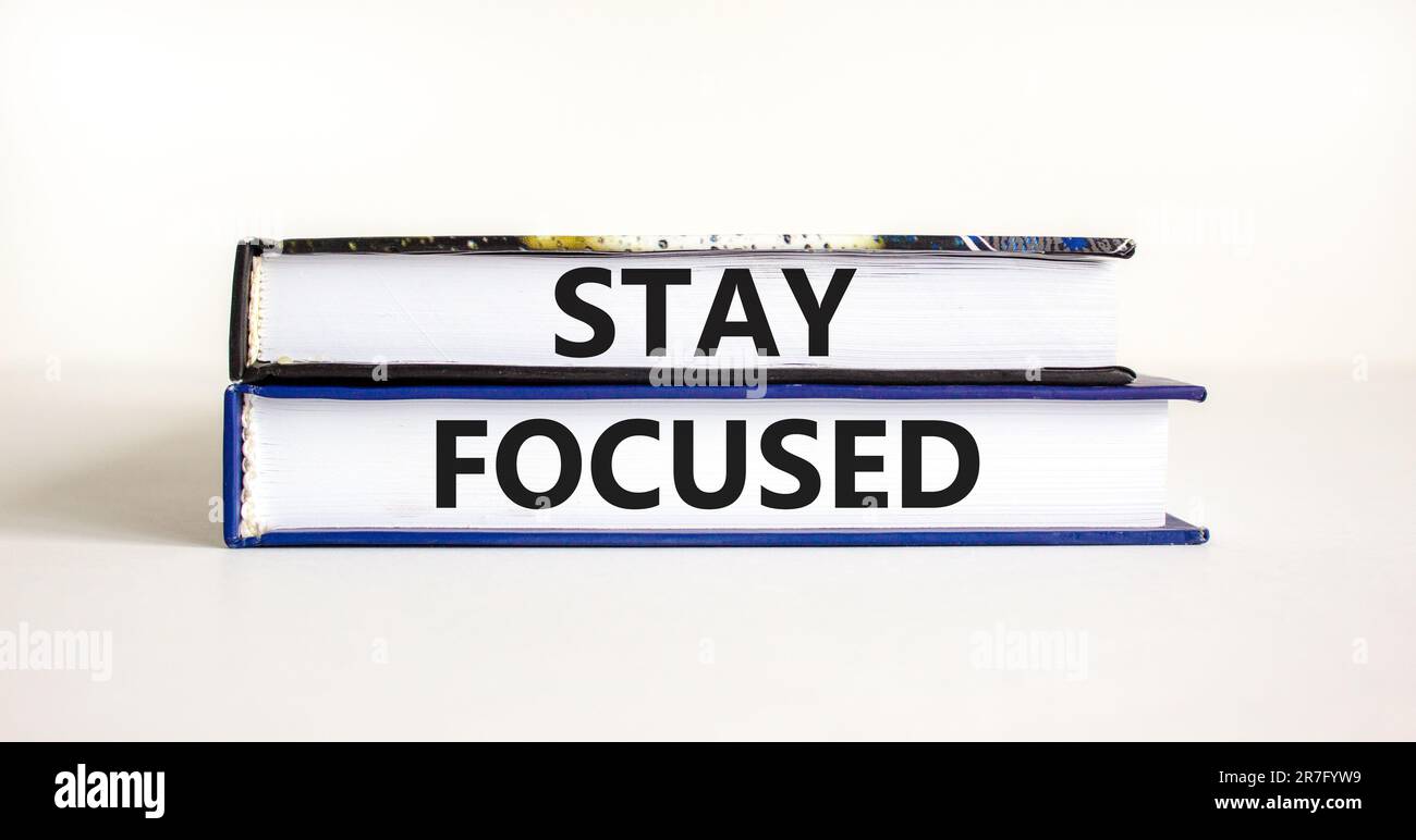 Stay focused symbol. Concept words Stay focused on beautiful books on a ...