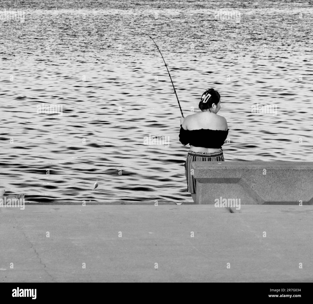 Silhouette woman fishing Black and White Stock Photos & Images - Alamy