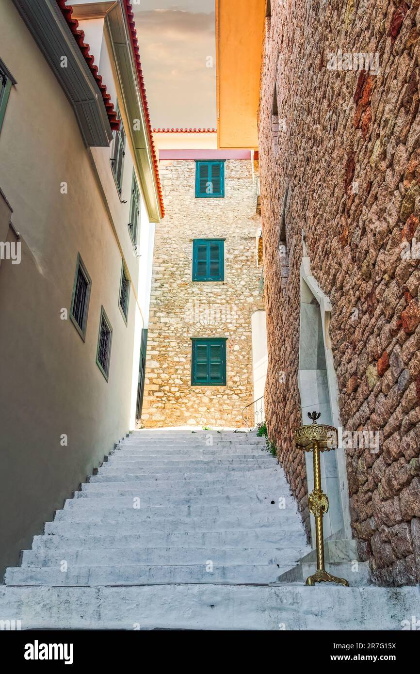 White-painted stone steps around traditional houses with a candle ...