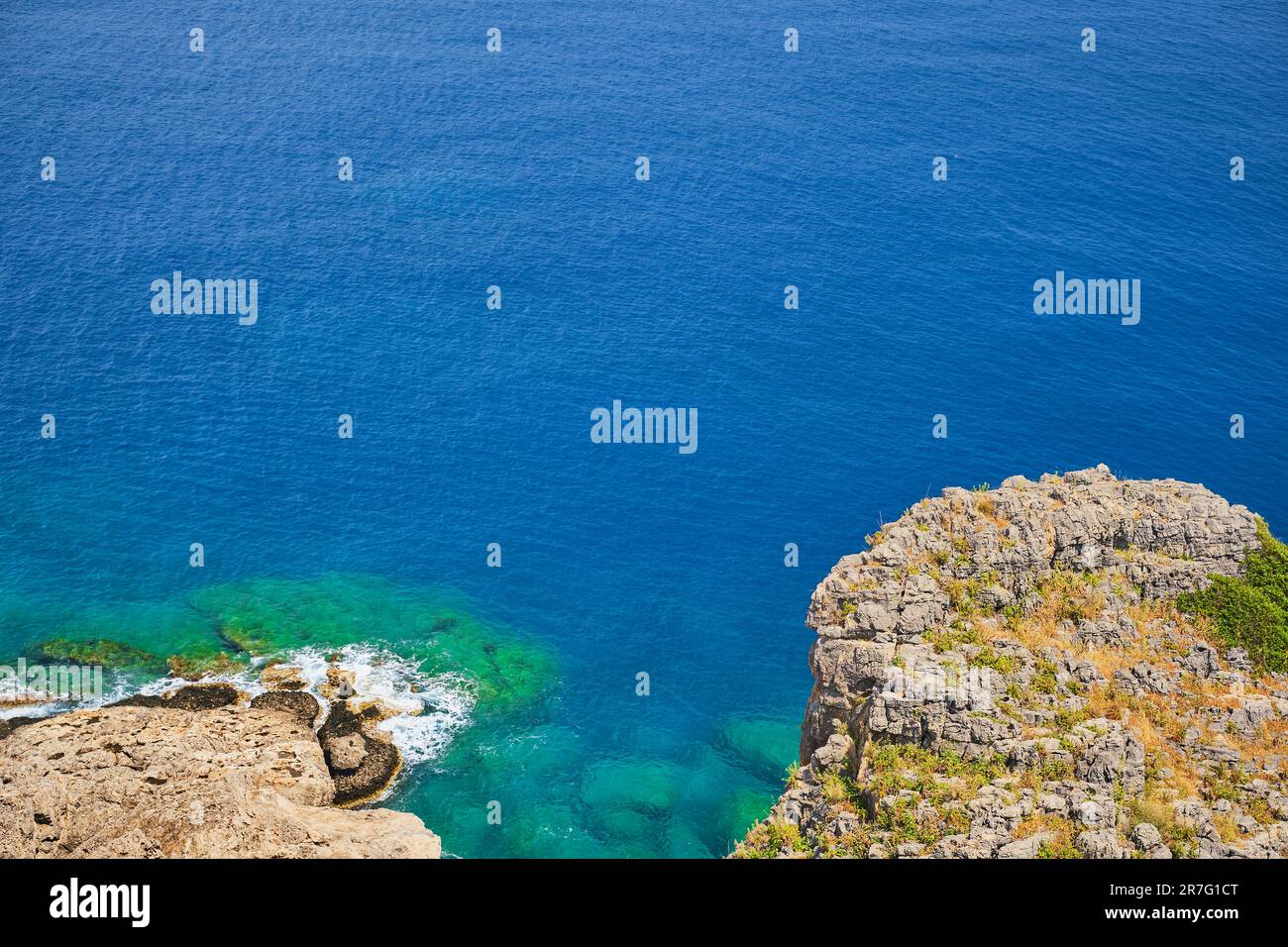 View from the acropolis of Lindos to the clear blue sky and emerald sea ...