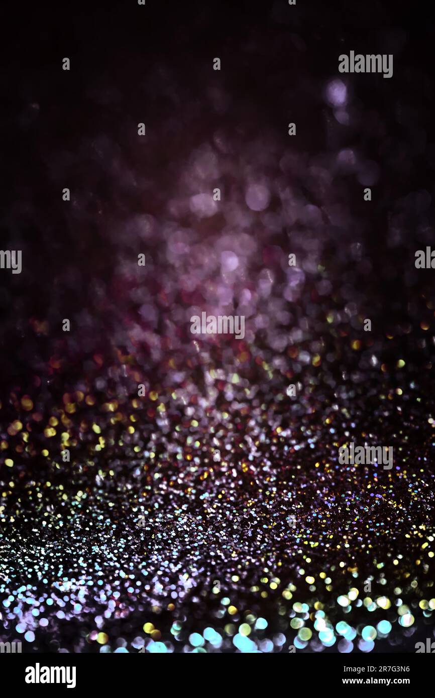Blurred multicolor black background with glitter. Abstract space ...