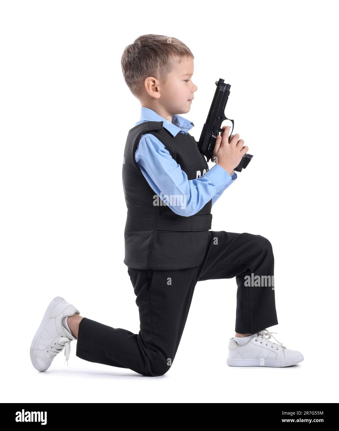 Funny little police officer with gun on white background Stock Photo ...