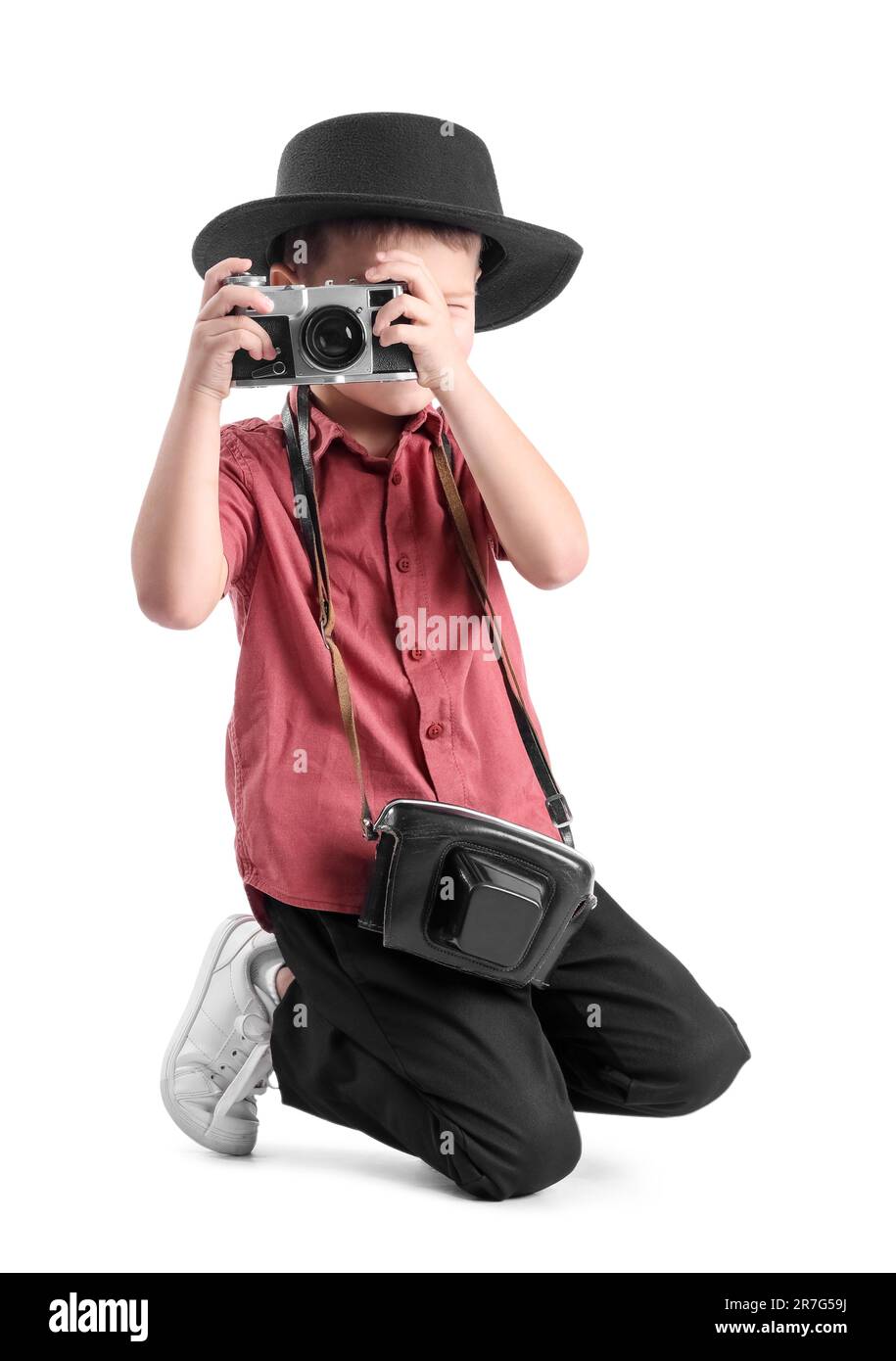 Cute little photographer with camera on white background Stock Photo ...
