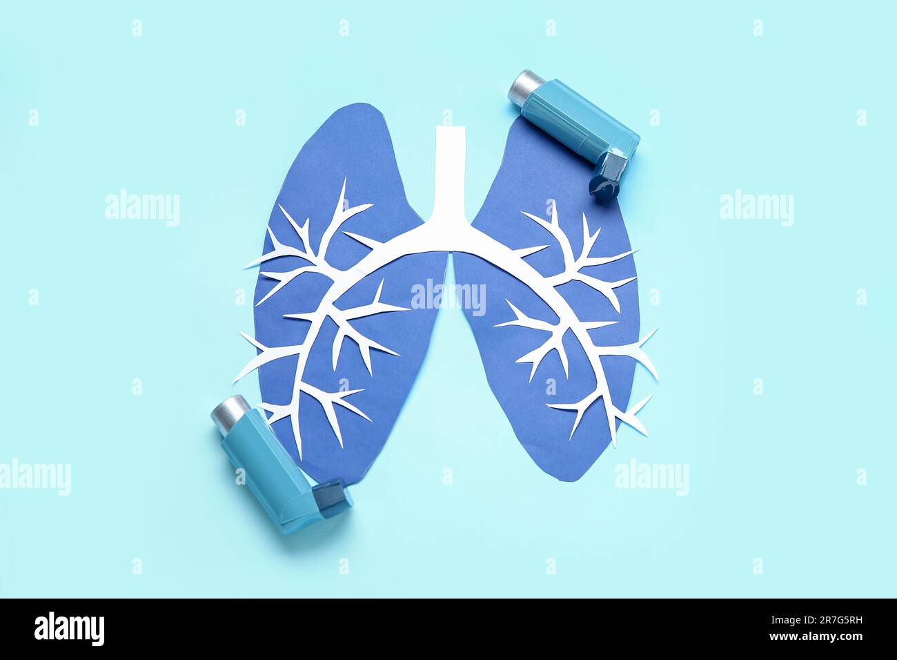Paper lungs and asthma inhalers on blue background Stock Photo - Alamy