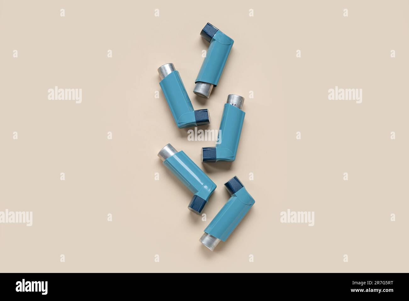 Asthma inhalers on beige background Stock Photo - Alamy