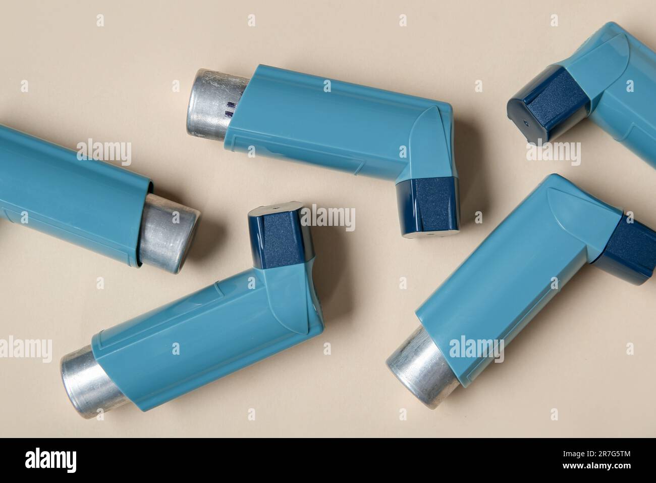 Asthma inhalers on beige background Stock Photo - Alamy