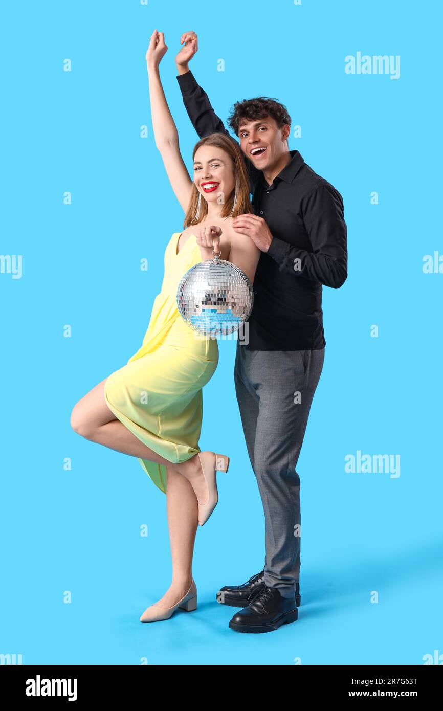 Beautiful prom couple with disco ball on blue background Stock Photo ...