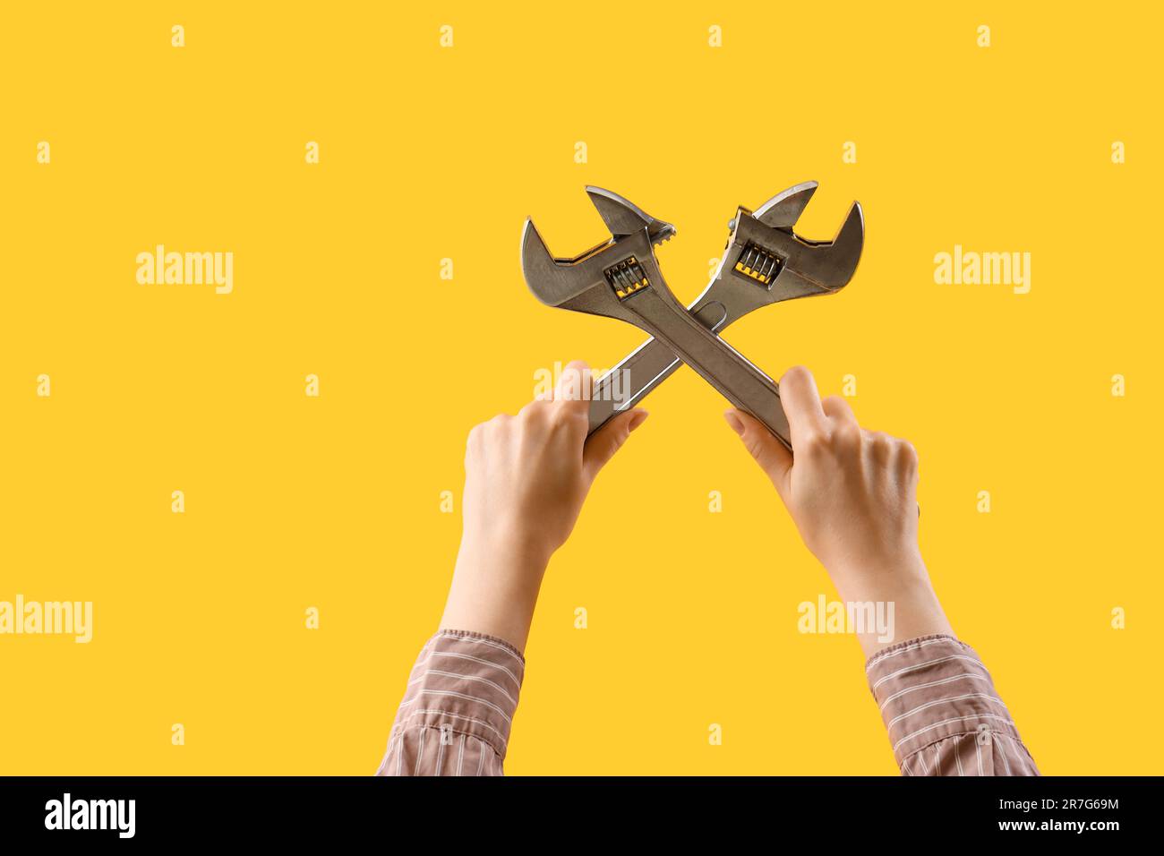Yellow female building wrench hi-res stock photography and images - Alamy