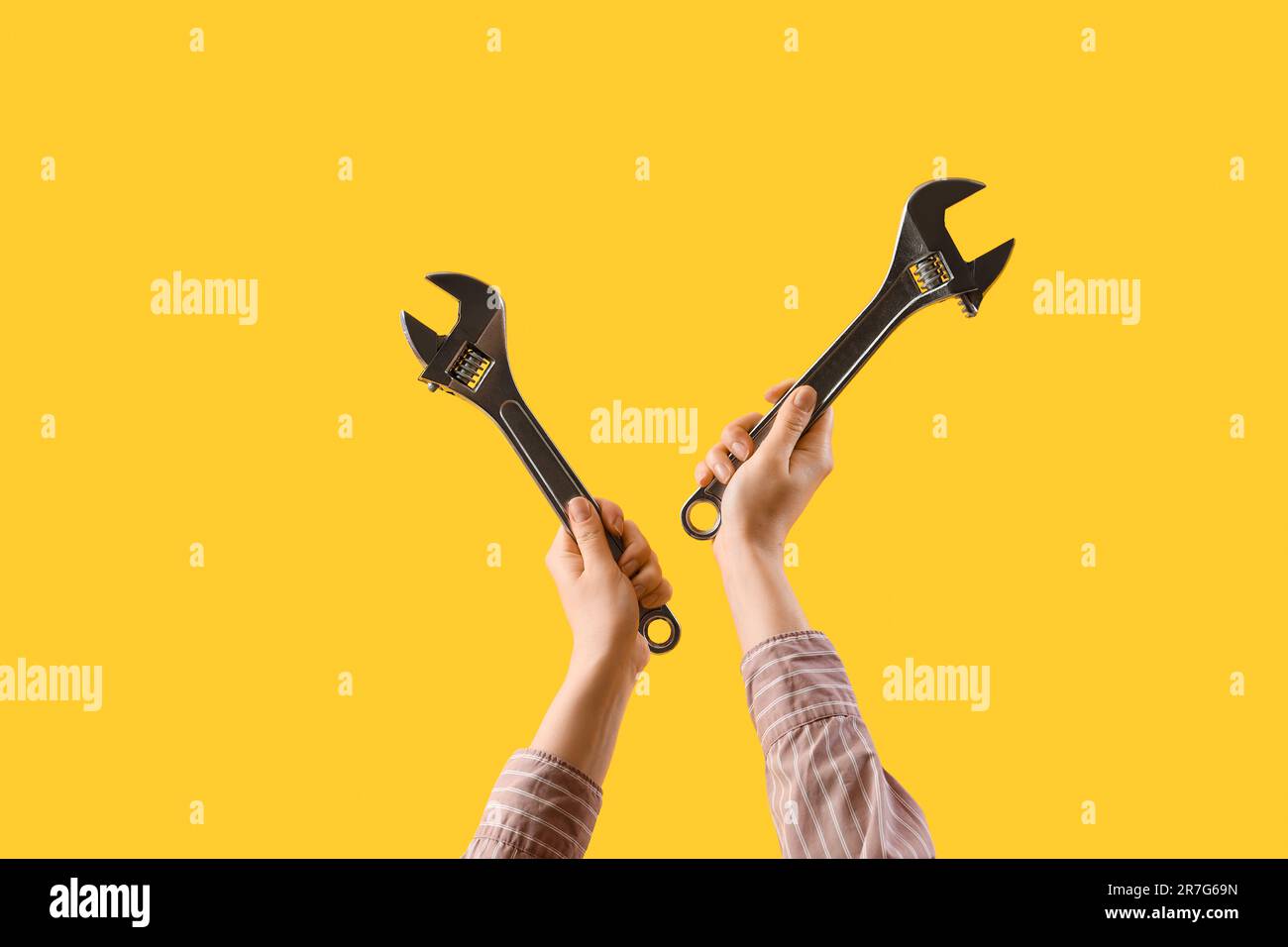 Yellow female building wrench hi-res stock photography and images - Alamy