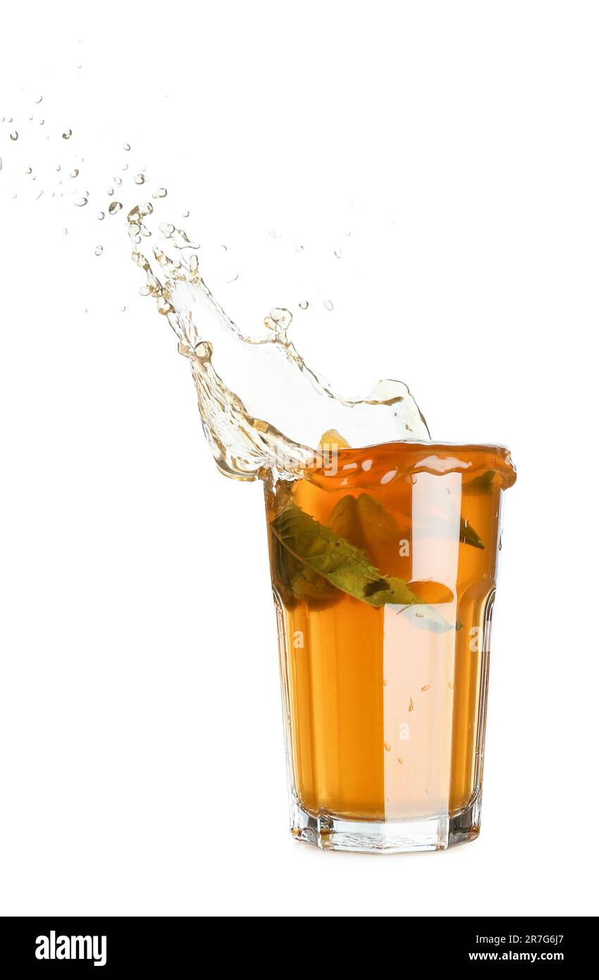 Glass of ice tea with splashes on white background Stock Photo - Alamy