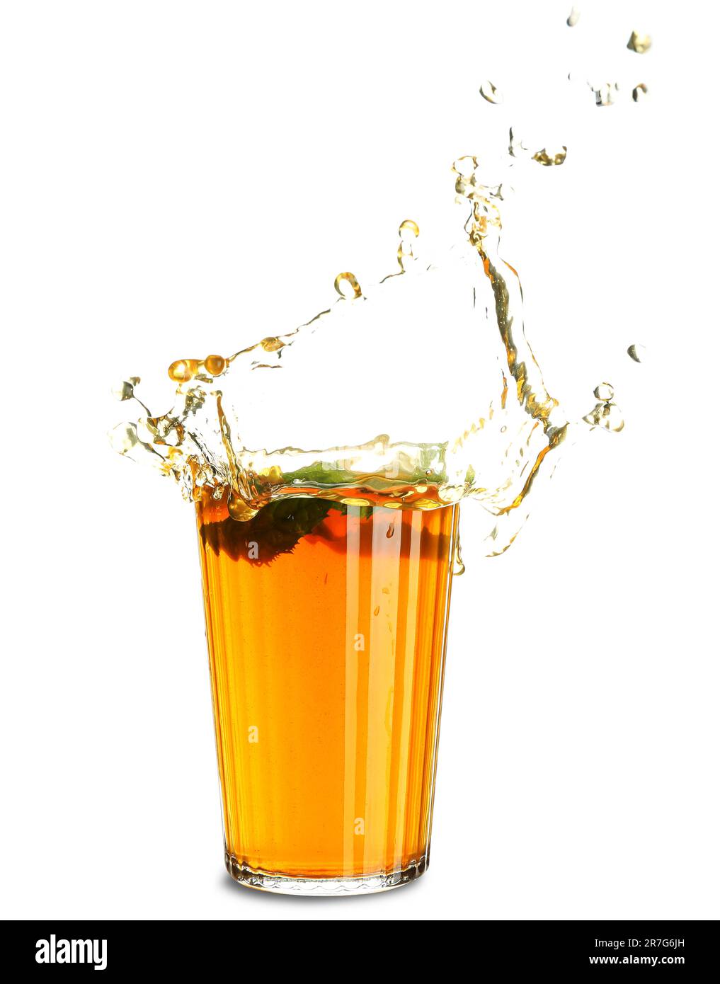 Glass of ice tea with splashes on white background Stock Photo - Alamy