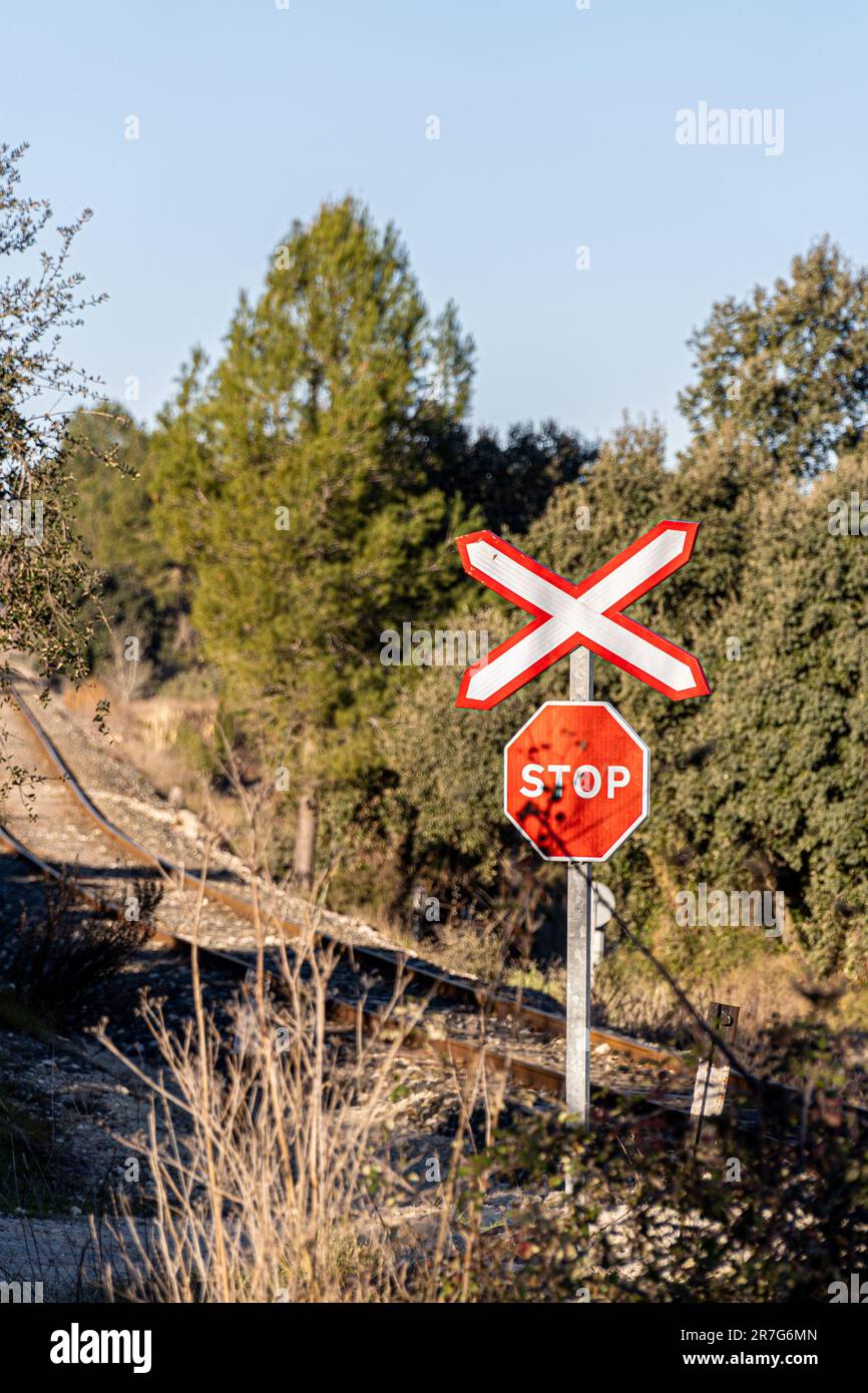 A red octagonal sign with white lettering indicating a 'Stop' command ...