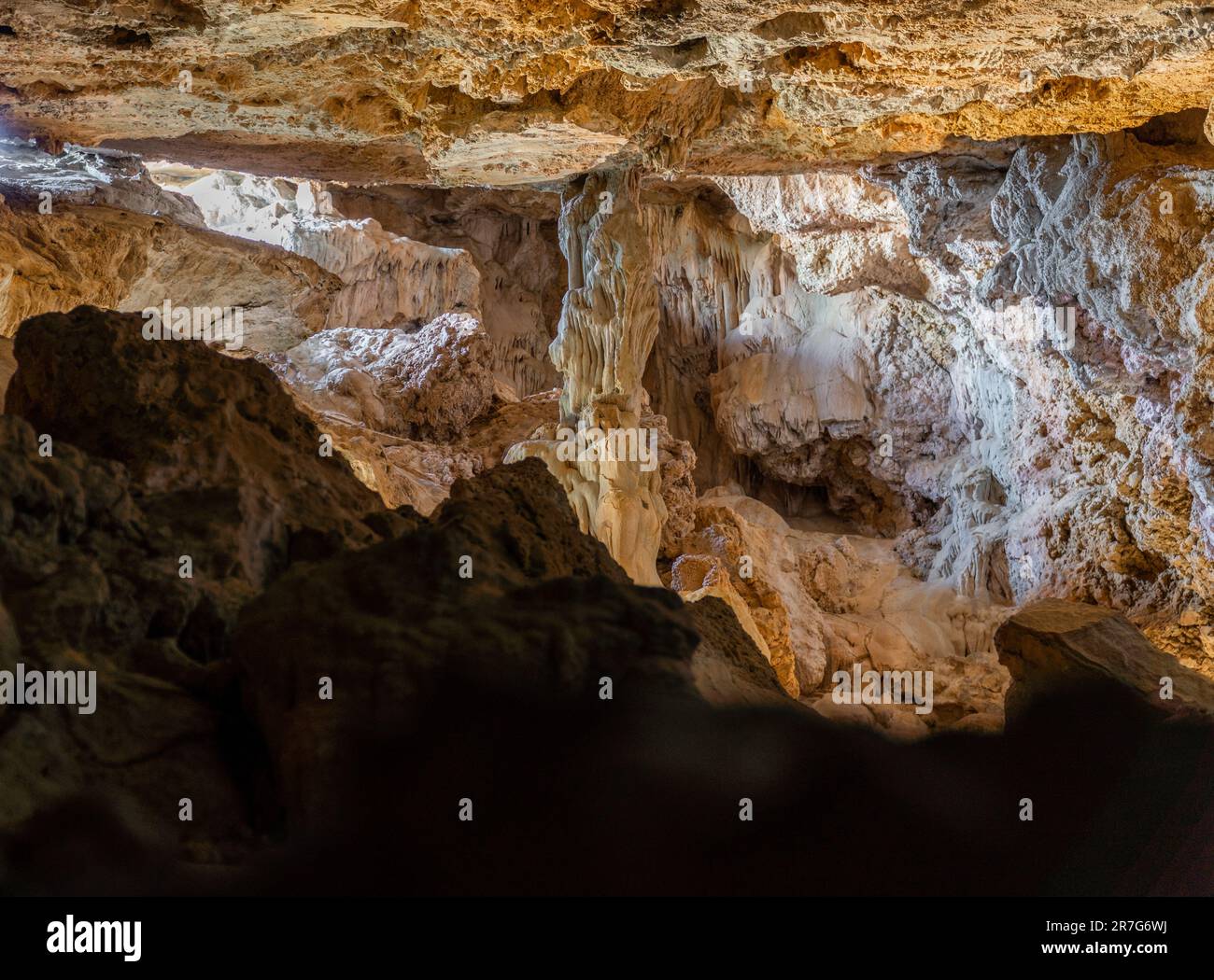 This stunning image features an interior of a natural cave, with a ...