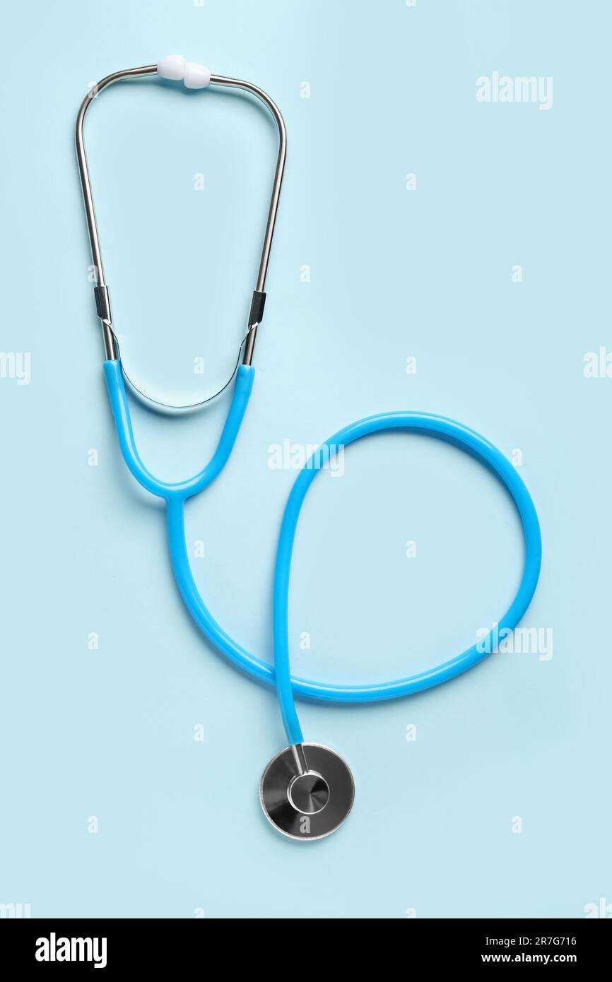 Modern stethoscope on light blue background Stock Photo - Alamy