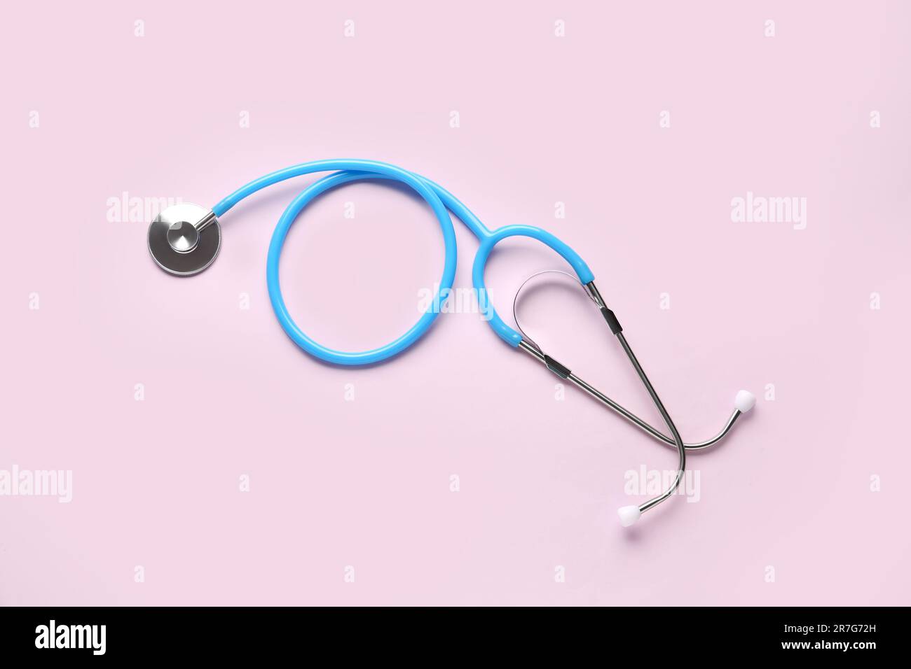 Modern stethoscope on pink background Stock Photo - Alamy