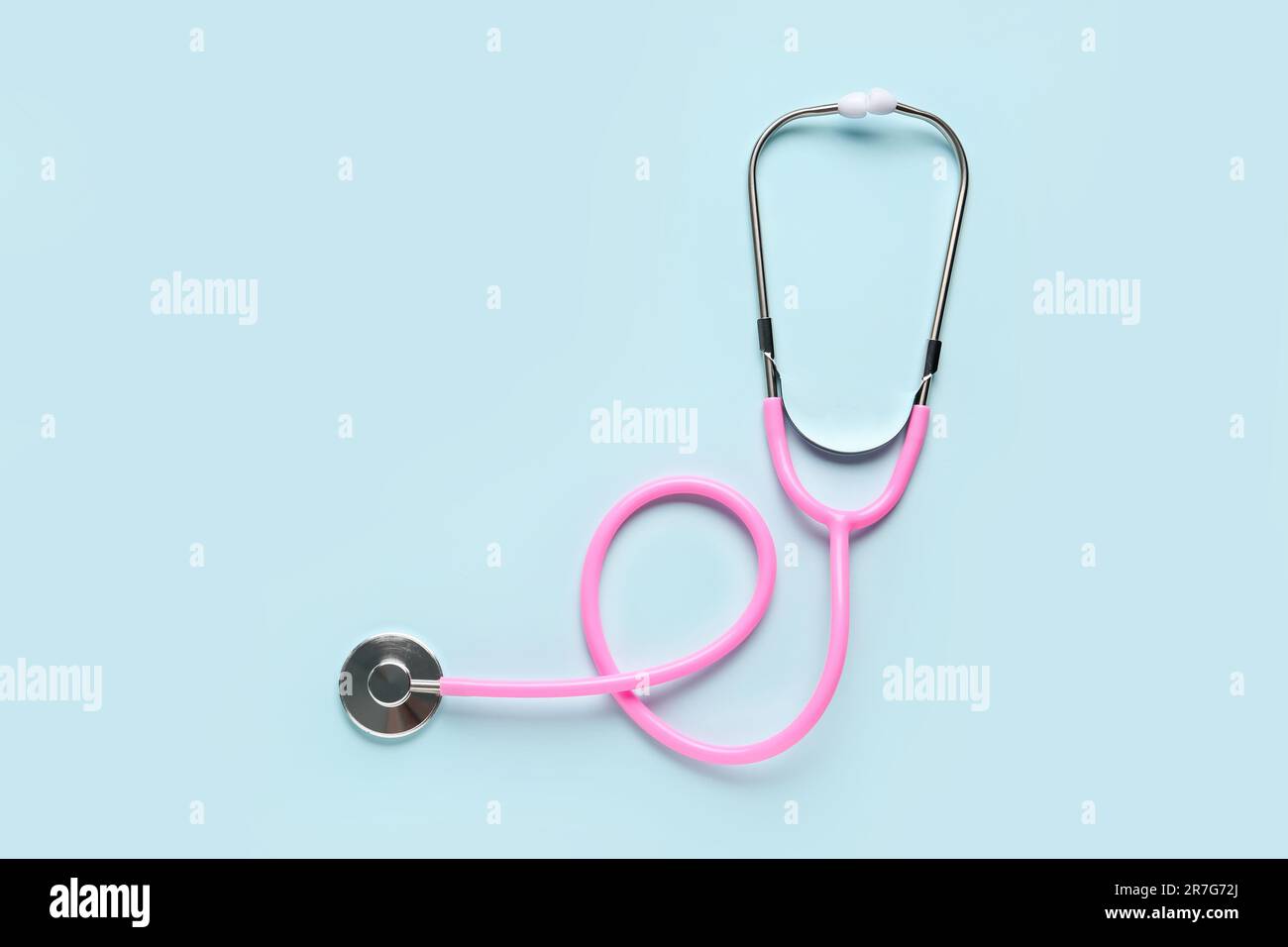 Modern stethoscope on light blue background Stock Photo - Alamy