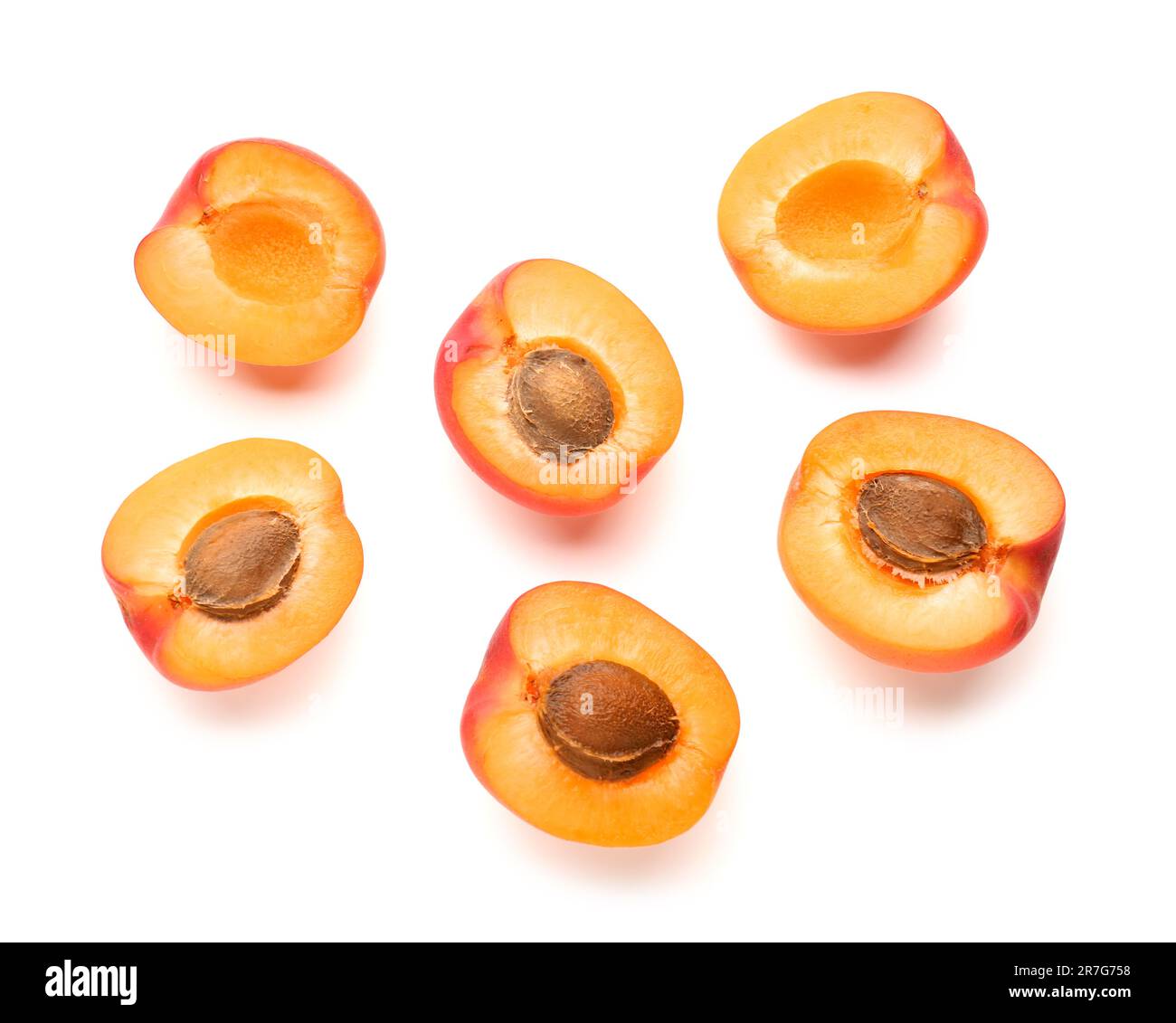 Halves of ripe apricot isolated on white background Stock Photo - Alamy