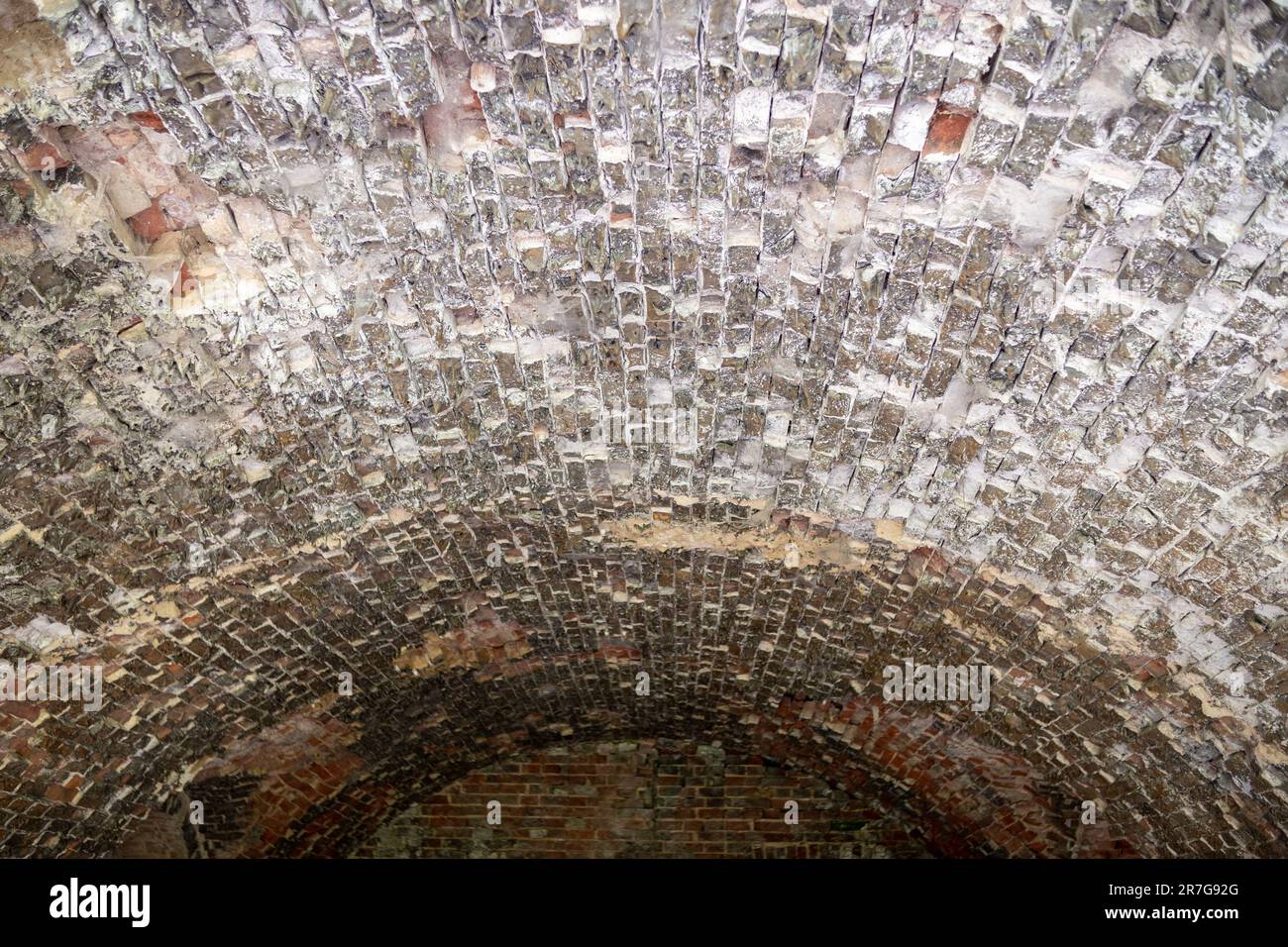 Heat-melted bricks on the vaults of the arch Stock Photo - Alamy