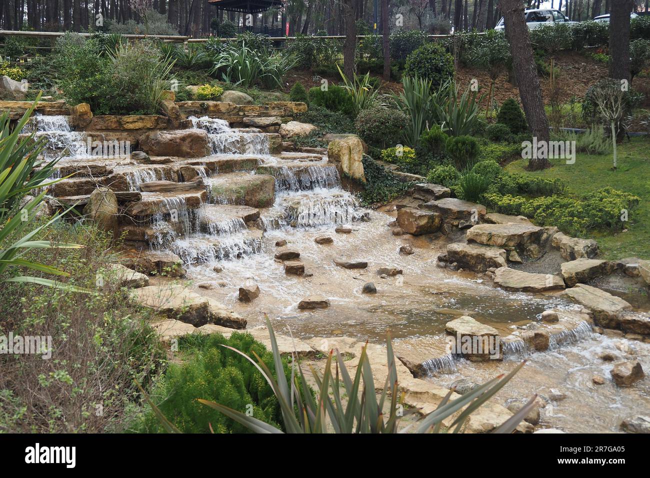 Decorative waterfall flowing from high Stock Photo - Alamy