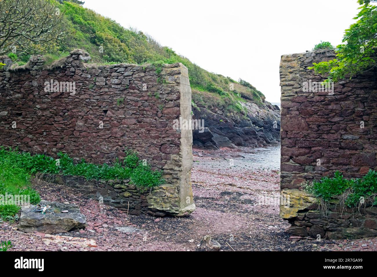 Gap in stone wall at Monk Haven beach along the Welsh Coast coastal ...