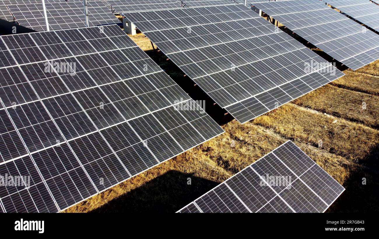 Solar power plant. Flight over modules of solar power station on sunny ...