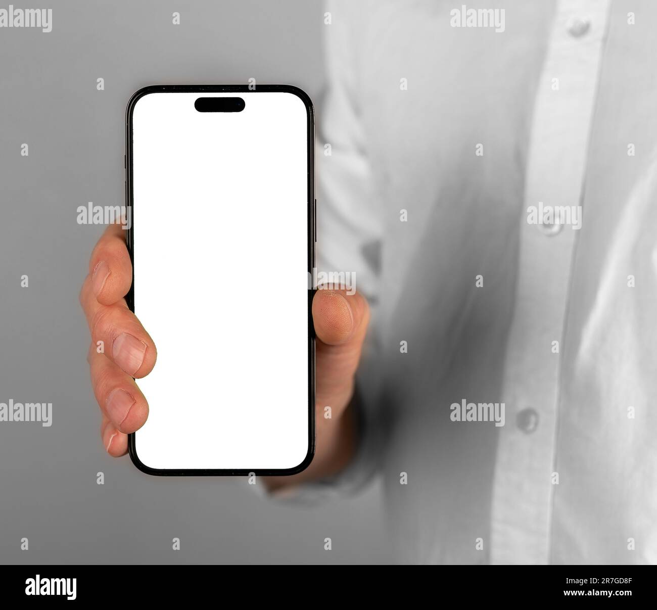 Lodz, Poland June 14 2023 Businessman hand holding mobile phone screen mock-up, iphone 14 pro ...