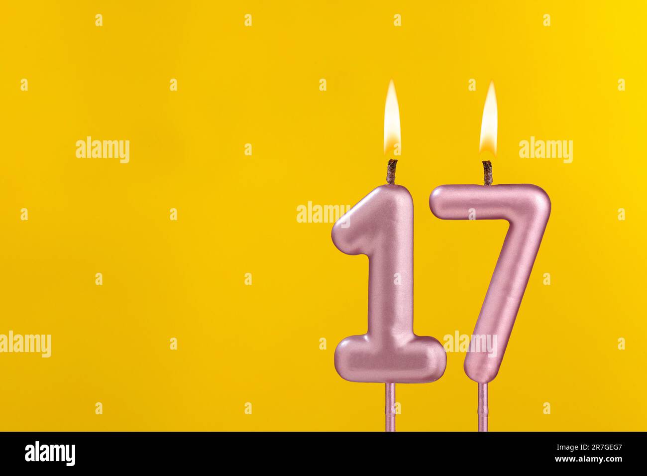 Birthday candle number 17 - Birthday celebration on yellow background ...