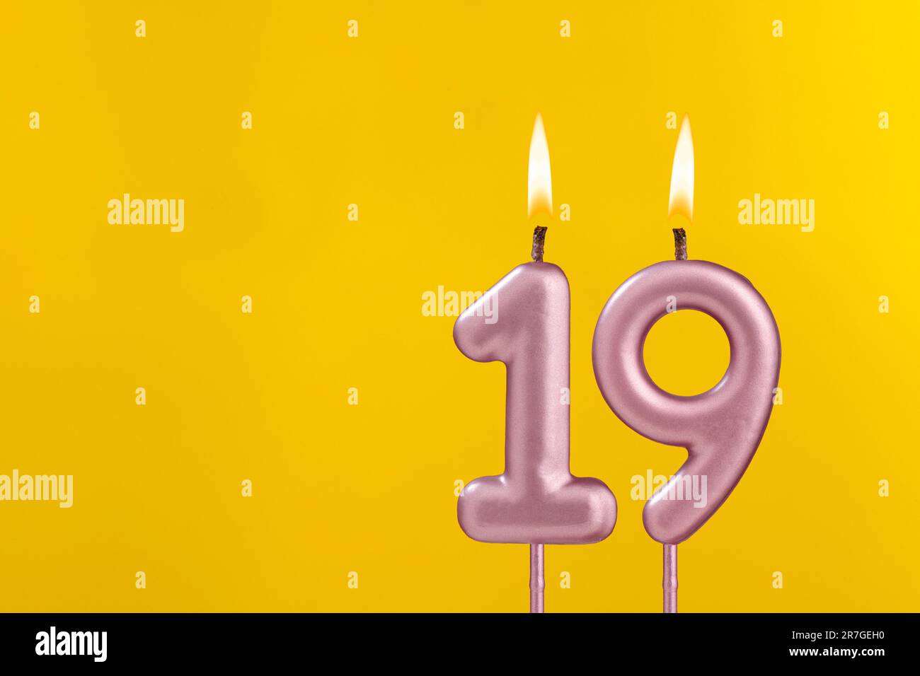 Birthday candle number 19 - Birthday celebration on yellow background ...