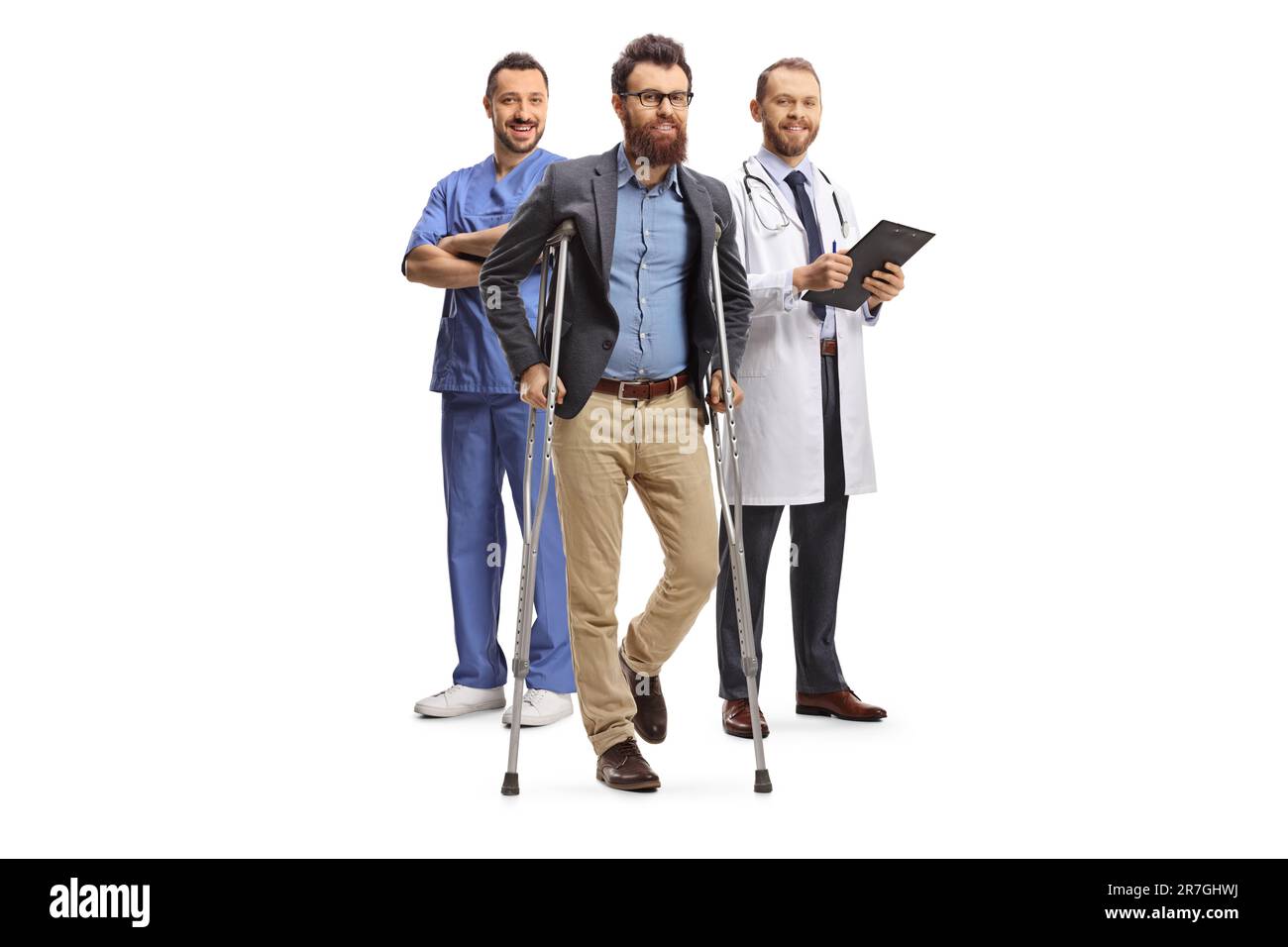 Medical team with a male patient standing with crutches isolated on ...