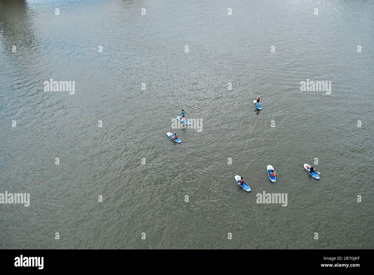 Stand up river paddle boarding Stock Photo - Alamy
