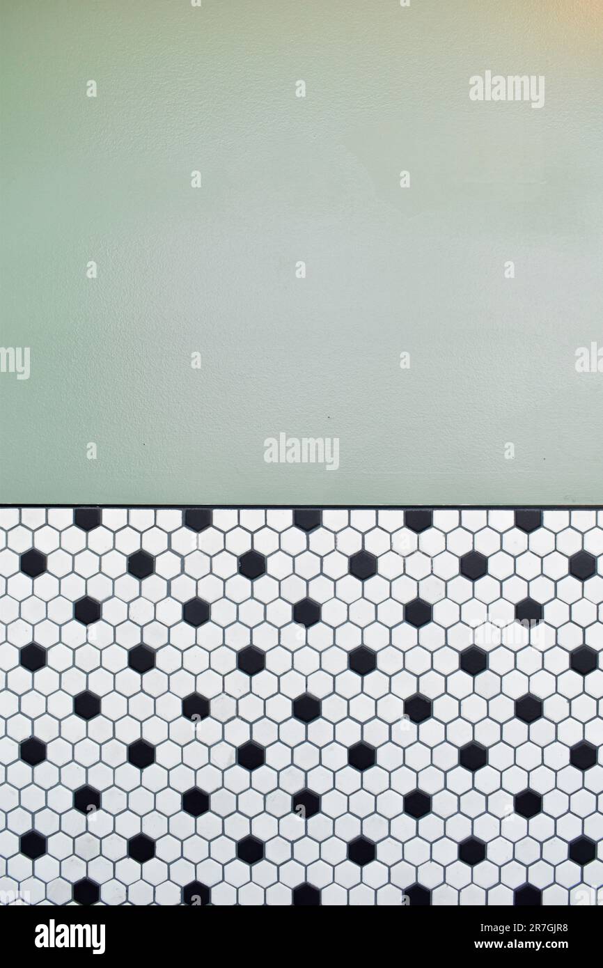 Painted wall and black and white hexagon tile design Stock Photo - Alamy