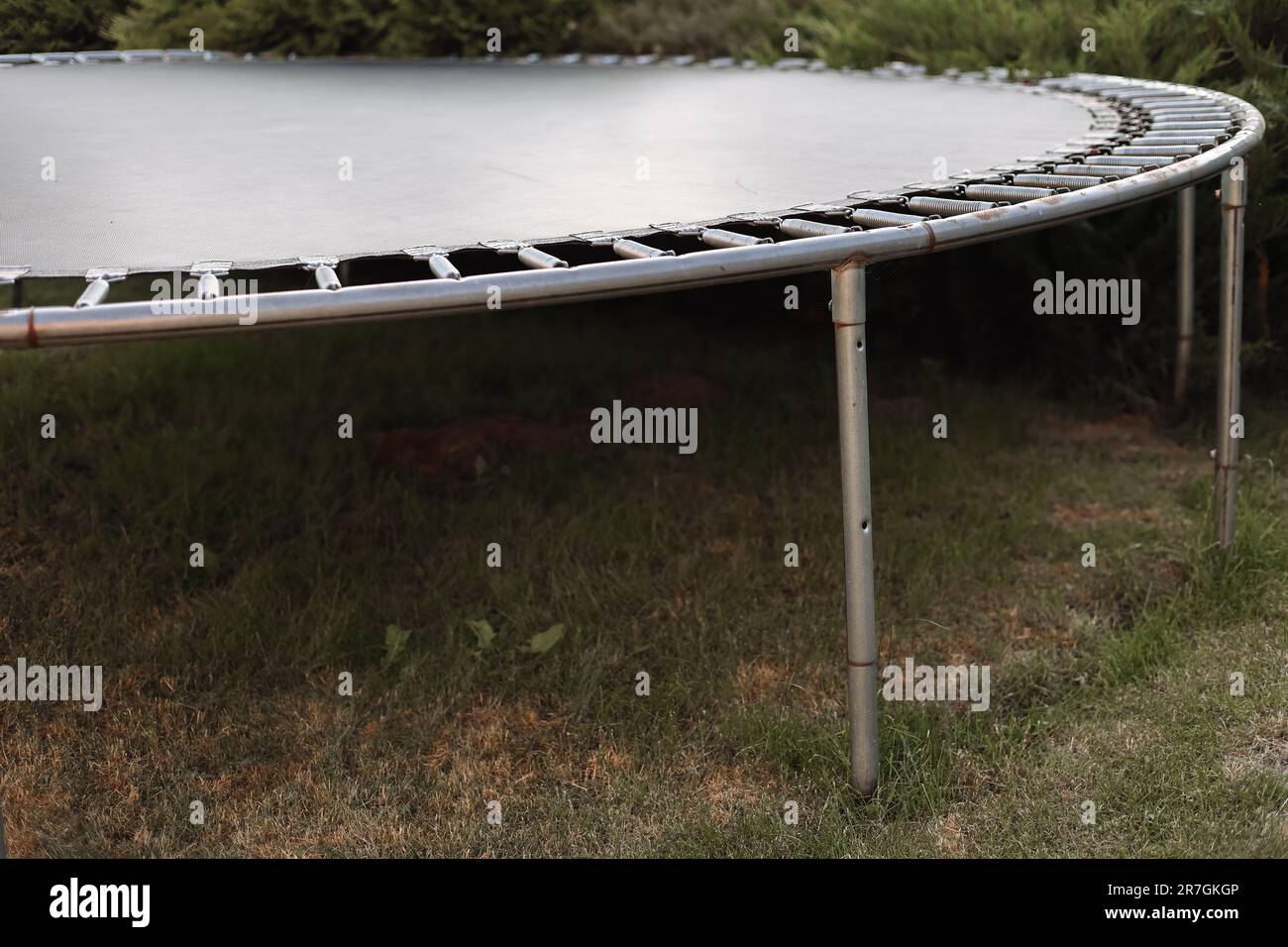 Recreation area. Modern opened trampoline without barrier, metal ...