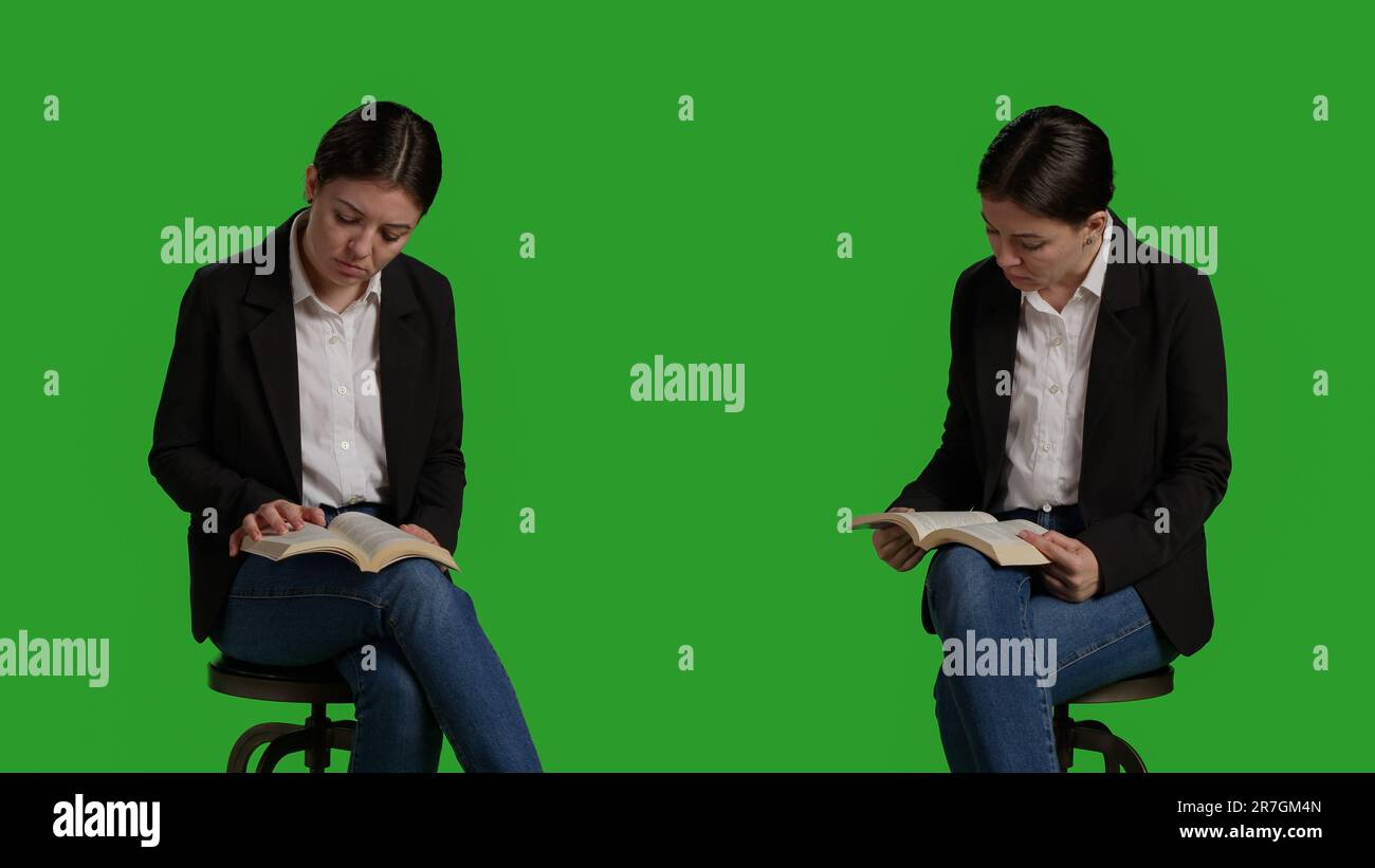 Close up of businesswoman reading book and sitting on chair, focusing ...