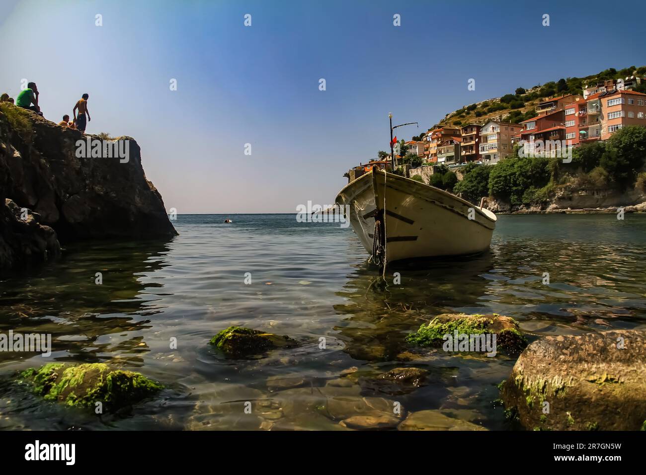 Wide Angle View Of A Boat And Landscape In The Small Harbor Of Amasra Wide Angle View Of A Boat And Landscape In The Small Harbor Of Amasra