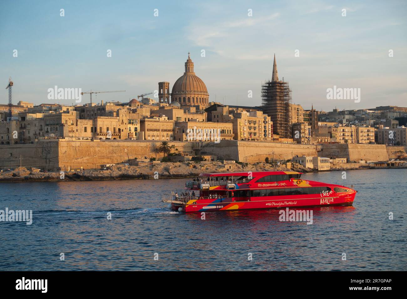 City Sightseeing Malta red boat trip Harbour Cruise, on background ...