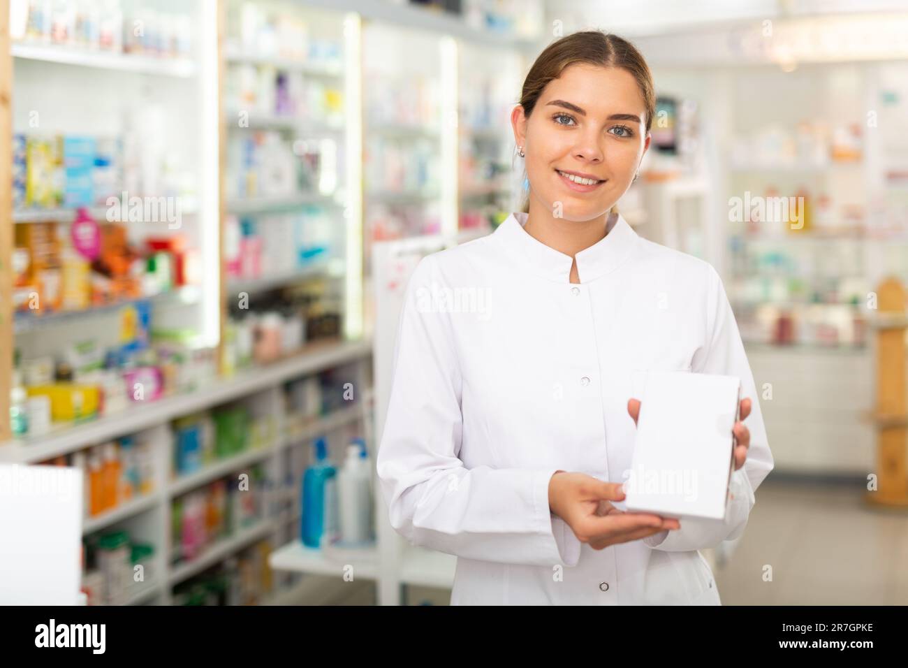 Doctor with drug package Stock Photo - Alamy