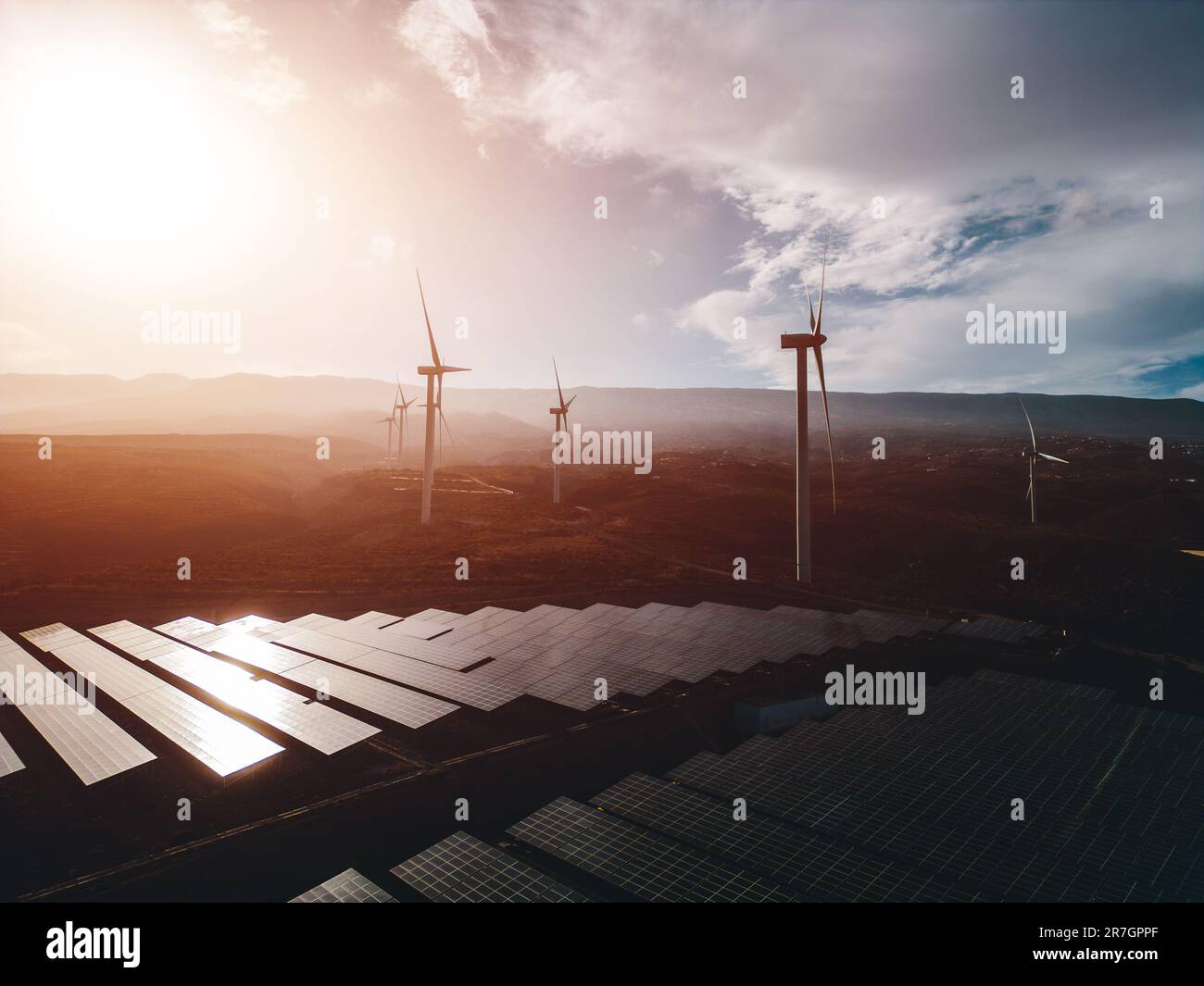 windmill and solar panel farm producing renewable energy with wind and ...