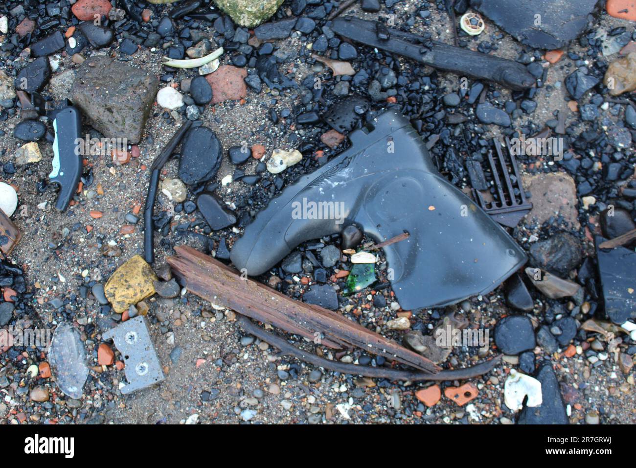 Pollution washed assure onto the beach - environmental harm to wildlife ...