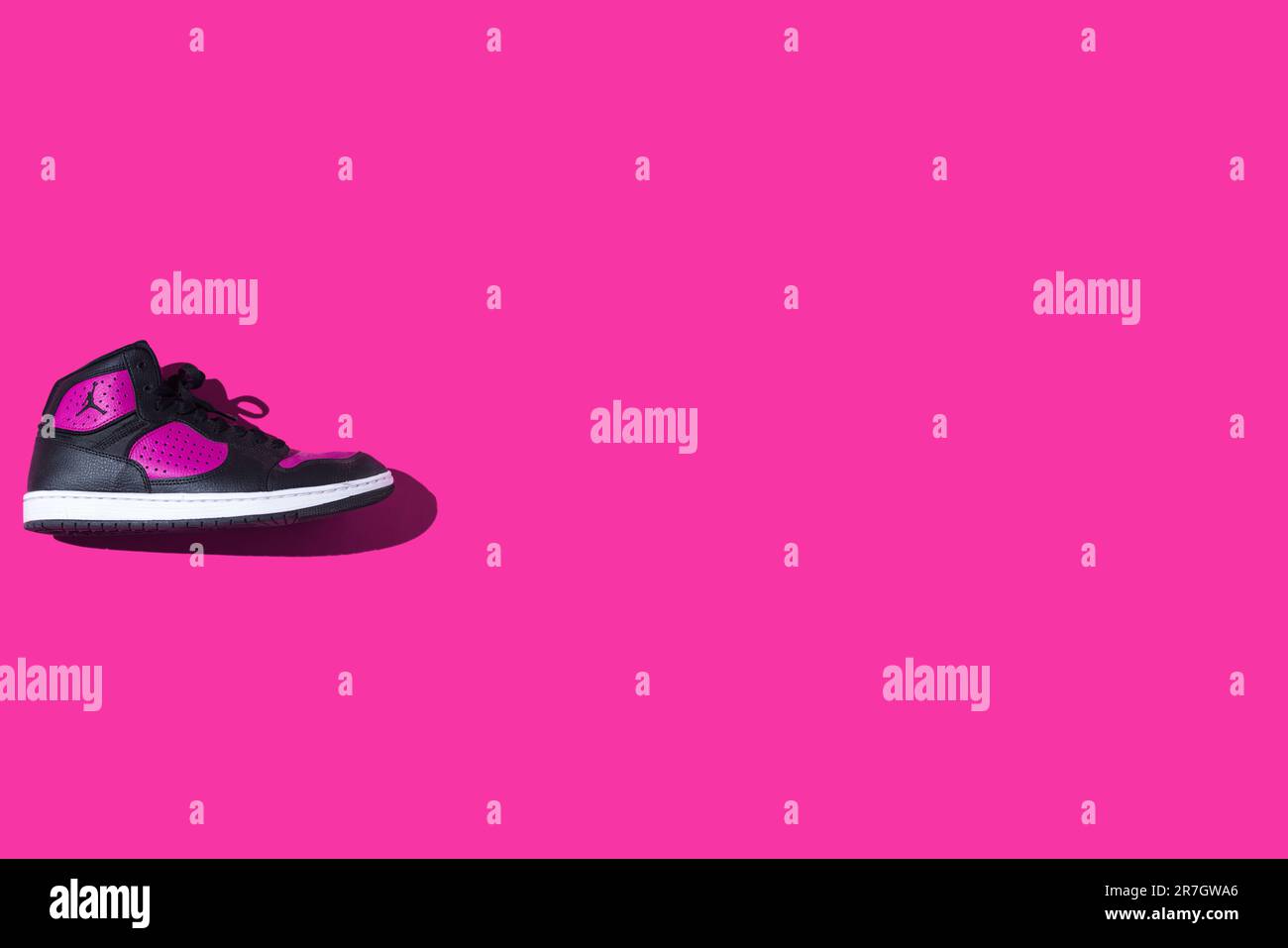 Black and purple NIKE Jordan Access shoes, on the left side, on a ...