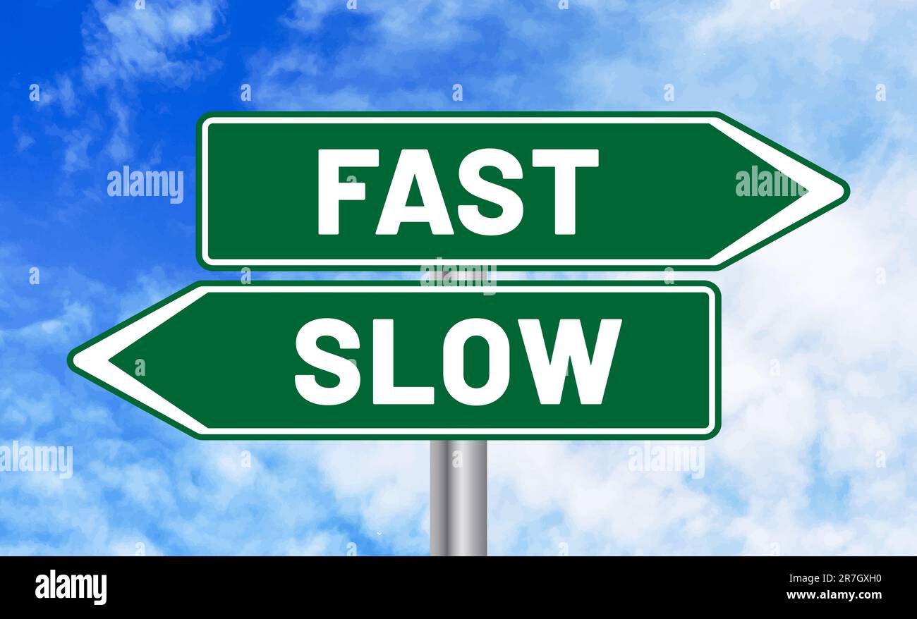 Fast or slow road sign on cloudy sky background Stock Photo - Alamy