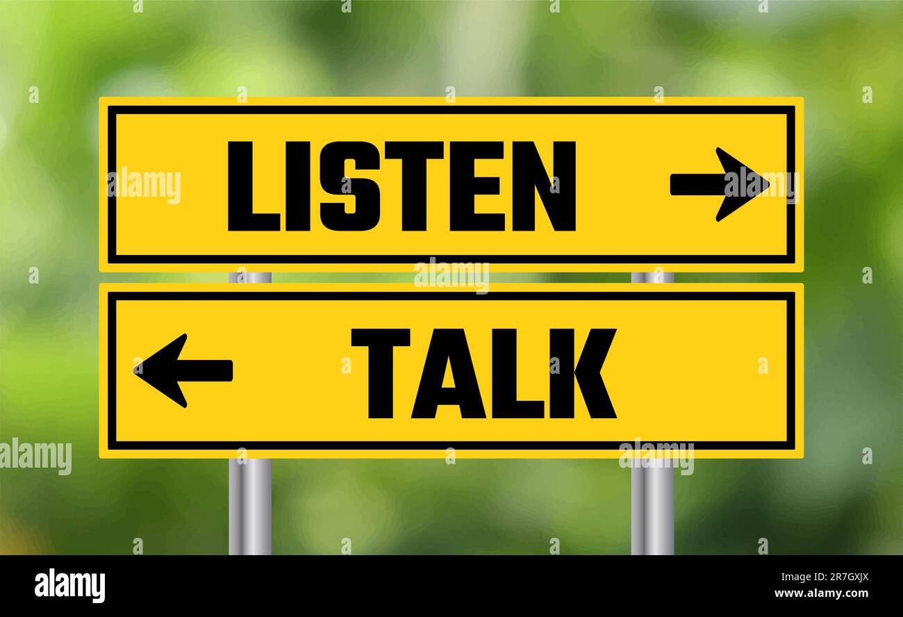 Listen or talk road sign on blur background Stock Photo - Alamy