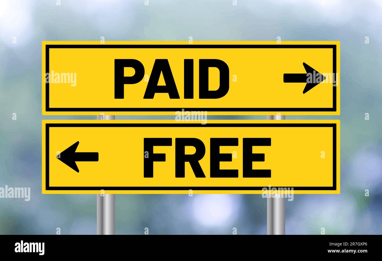 Paid or free road sign on blur background Stock Photo - Alamy