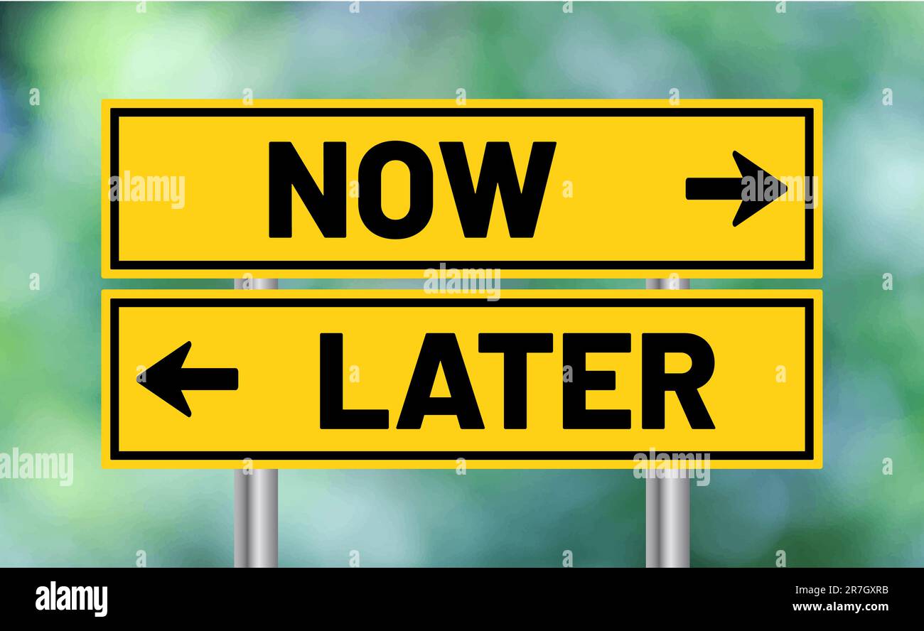 Now or later road sign on blur background Stock Photo - Alamy