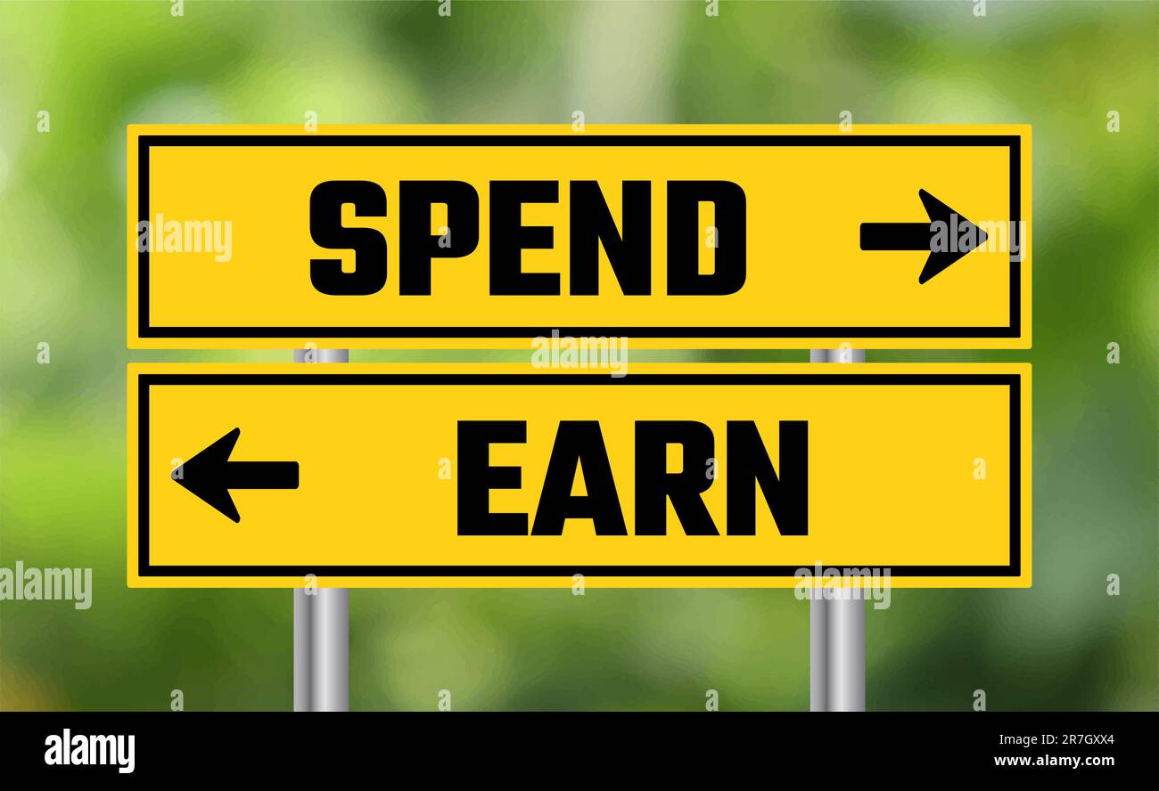 Spend or earn road sign on blur background Stock Photo - Alamy